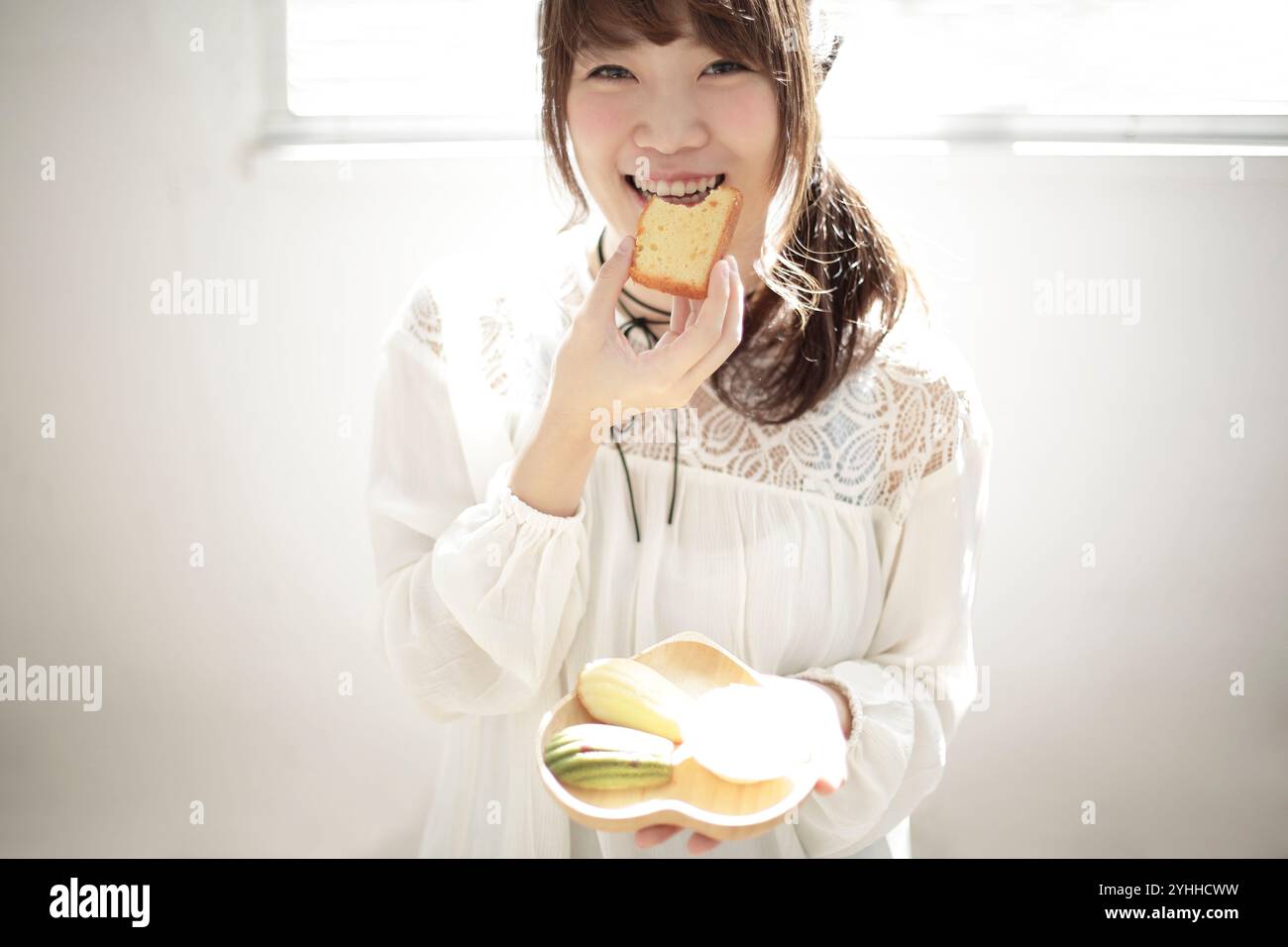 College student eating cake Stock Photo - Alamy