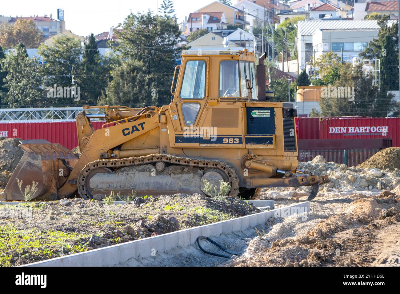 Yellow caterpillar 963 track loader parked on a construction site ...