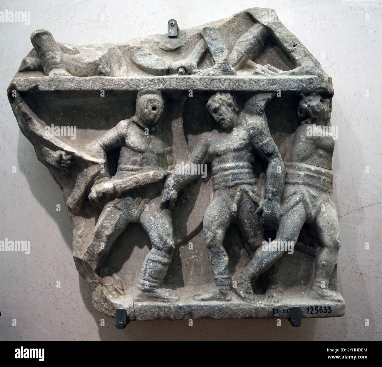 Gladiators. Relief showing a fight between a secutor (shied, short ...