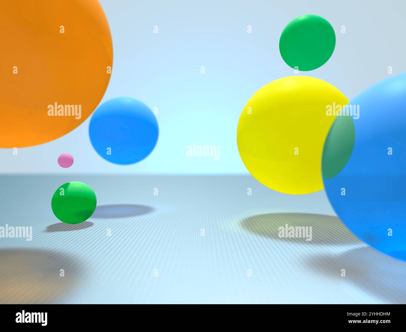 Large and small colourful translucent spheres floating on a flat ...