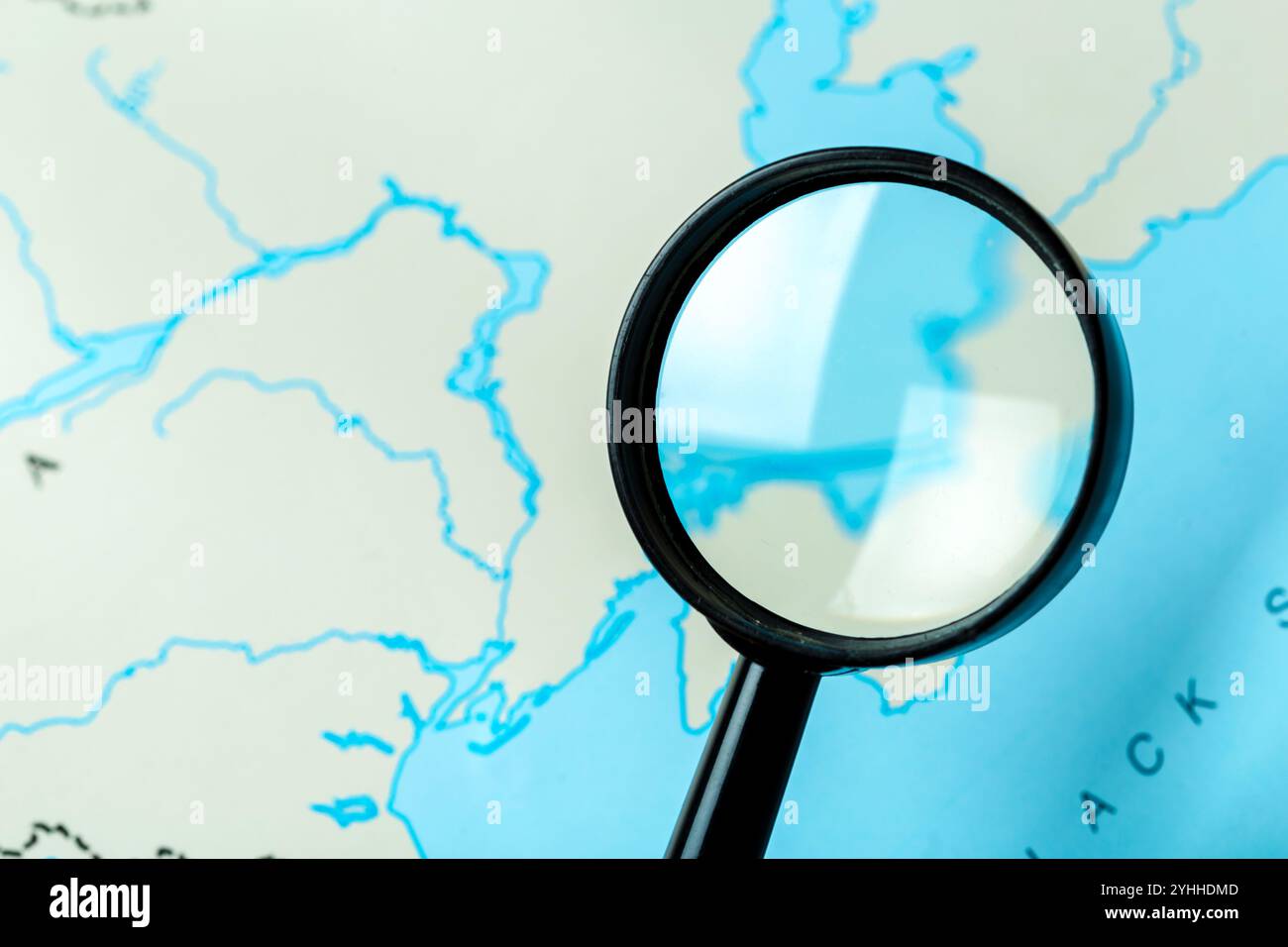 Magnifying glass and map Stock Photo - Alamy
