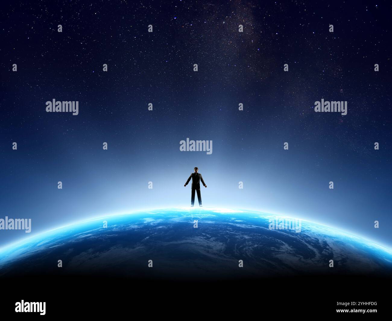 Man standing on earth Stock Photo - Alamy
