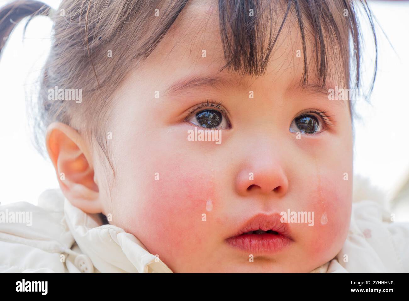 Girl with tears streaming down her cheeks Stock Photo - Alamy