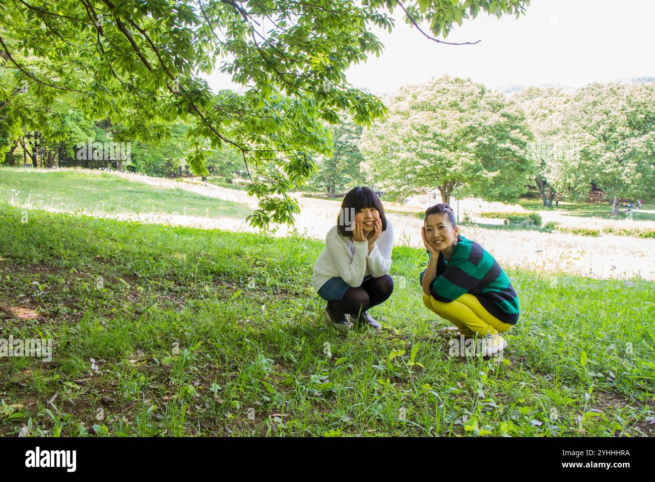 Sitting child and parent taking a photo Stock Photo - Alamy