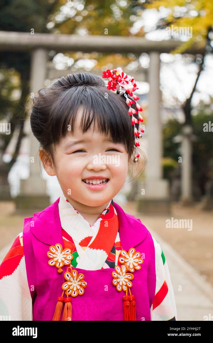 Girl in kimono smiling with squinting eyes Stock Photo - Alamy