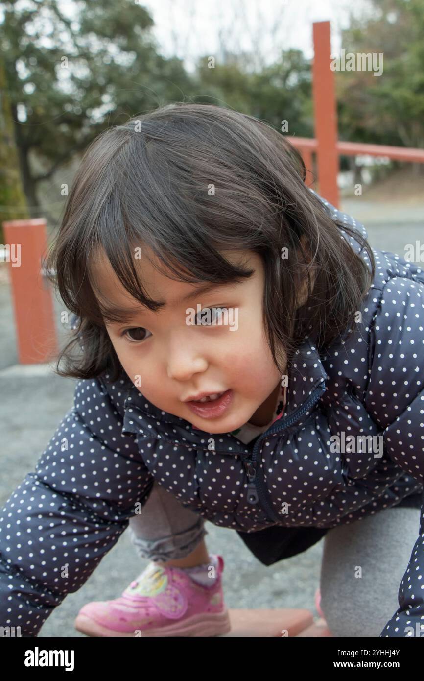 Girls playing in park Stock Photo - Alamy