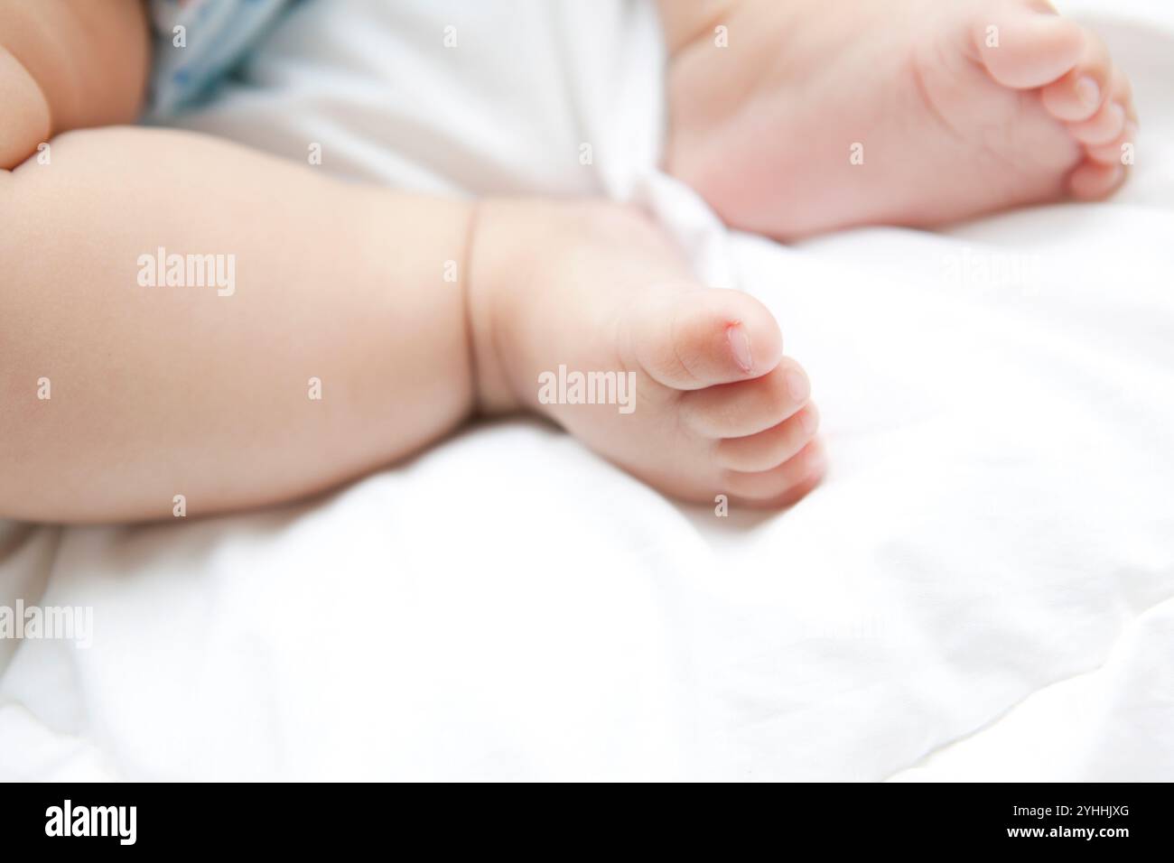 Sleeping infant's feet Stock Photo - Alamy