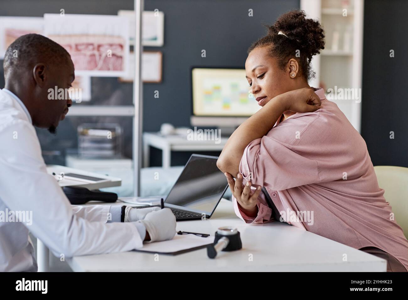 Side view portrait of adult African American woman explaining symptoms ...