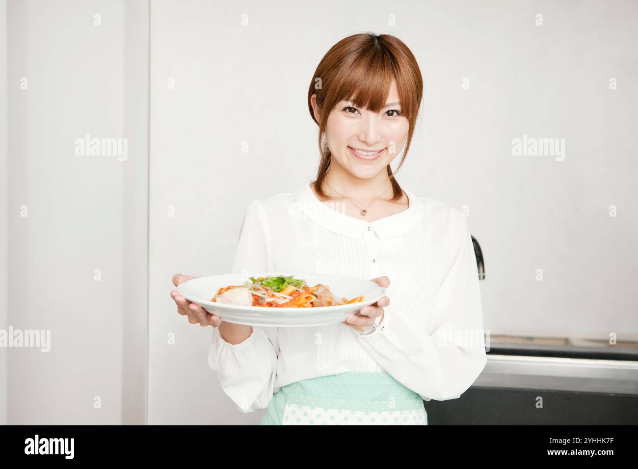 Woman holding food Stock Photo - Alamy