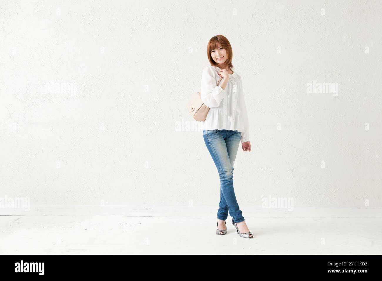 Slung over shoulder hi-res stock photography and images - Alamy