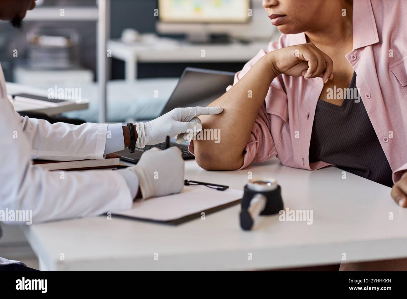 Side view closeup of unrecognizable doctor wearing glove and pointing ...