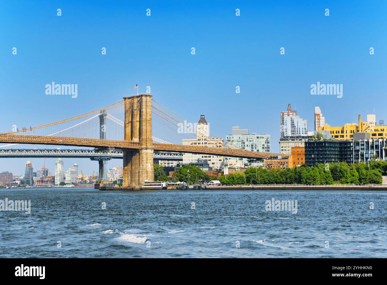 Suspended Brooklyn Bridge across the East River between the Lower ...