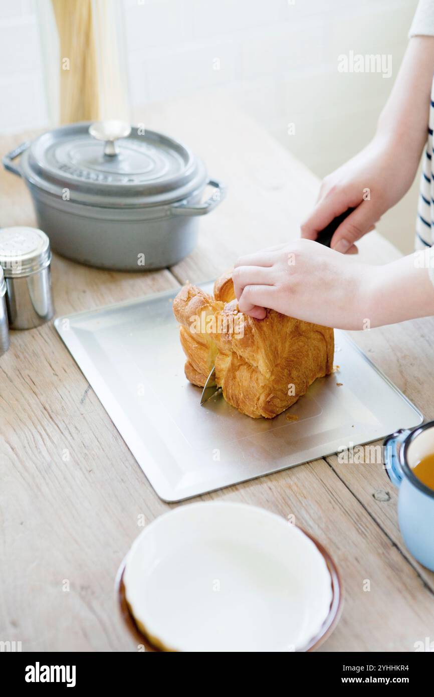 Hands cutting bread hi-res stock photography and images - Alamy