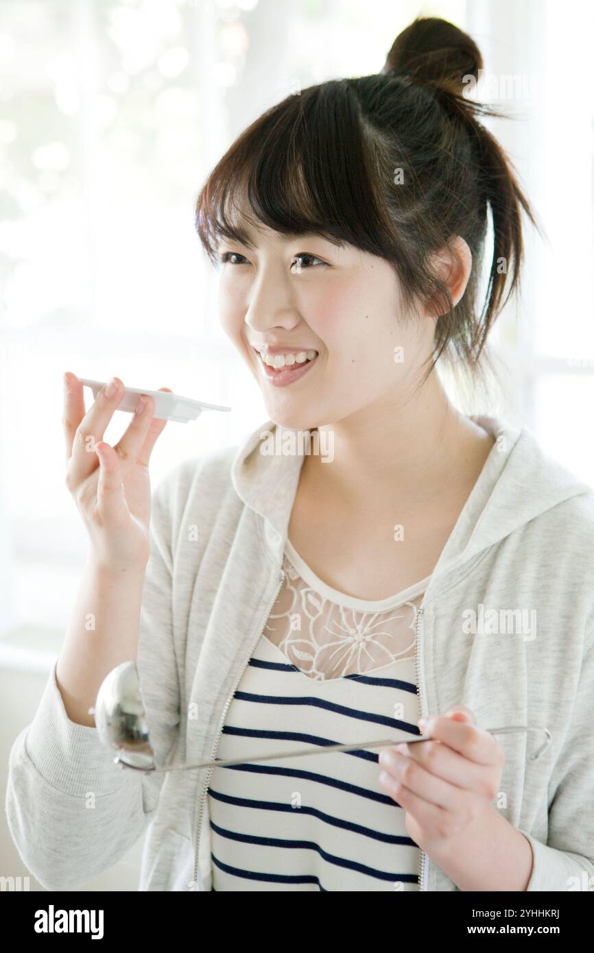 Young japanese woman tasting hi-res stock photography and images - Alamy