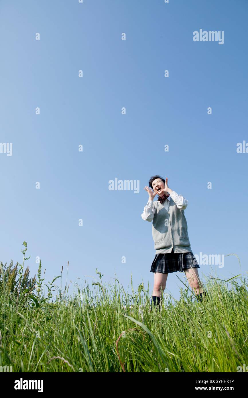High school girl shouting into the distance Stock Photo - Alamy