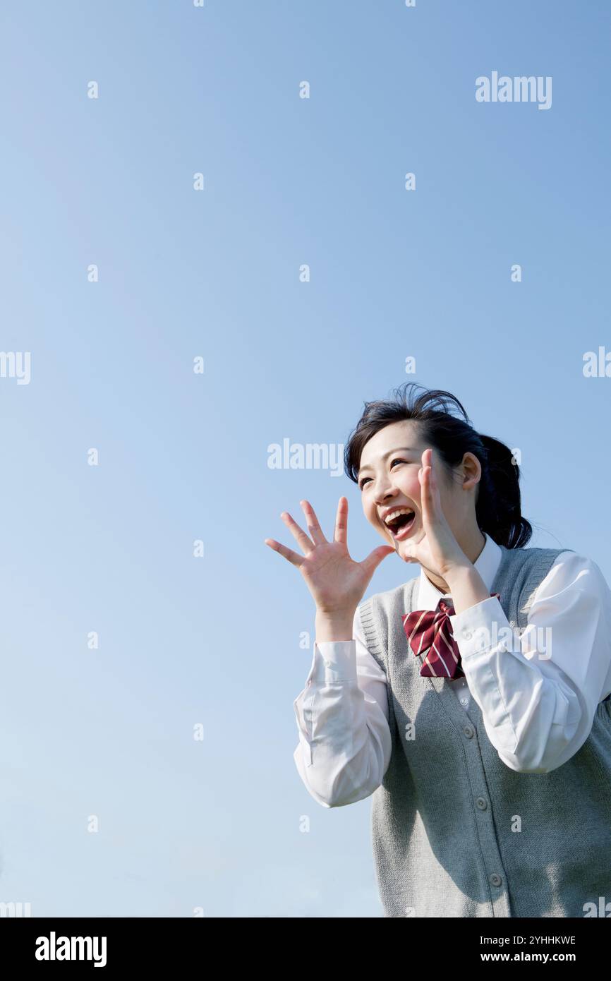 High school girl shouting into the distance Stock Photo - Alamy