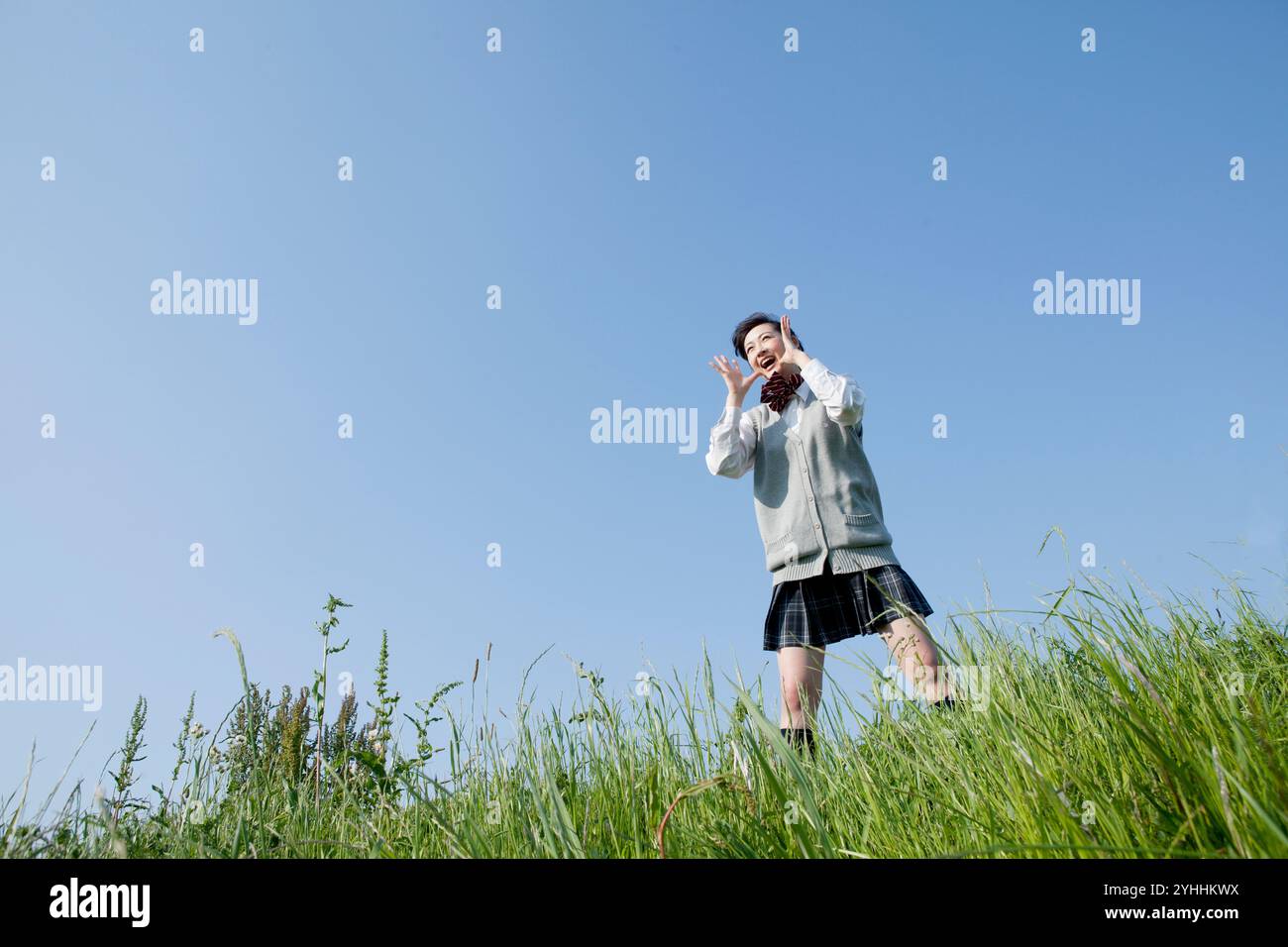 High school girl shouting into the distance Stock Photo - Alamy