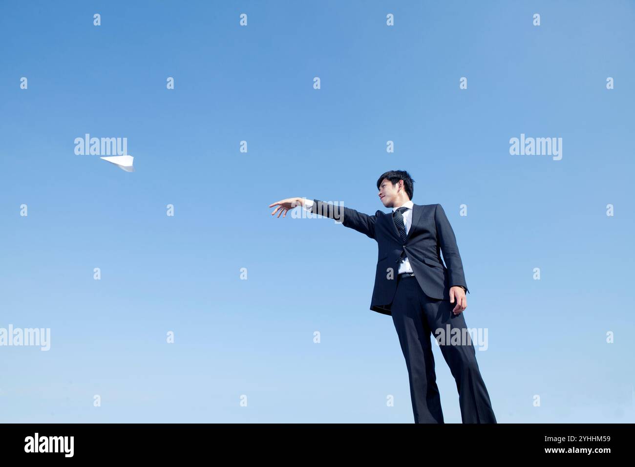 Business man flying paper hi-res stock photography and images - Alamy