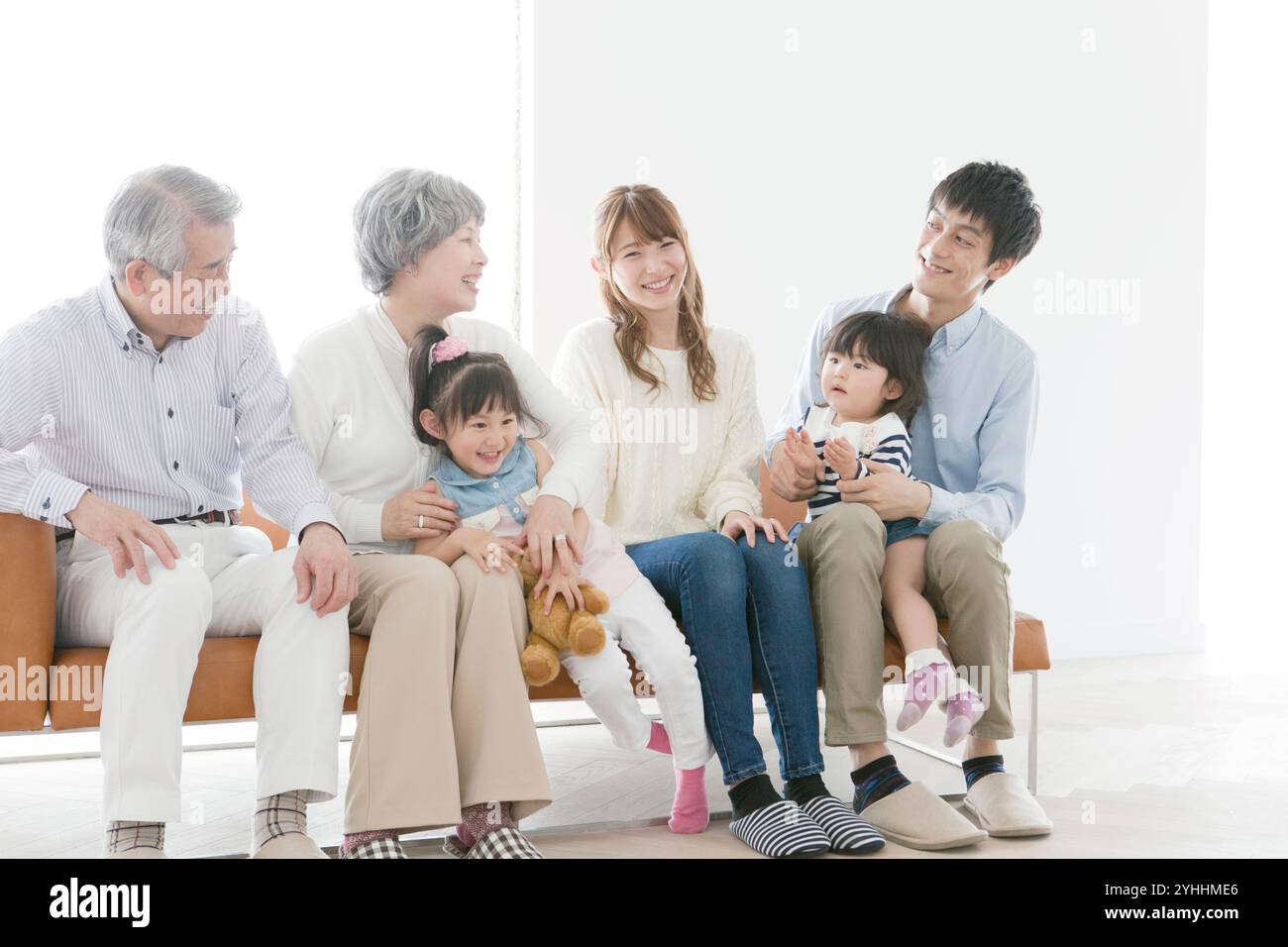Excited family sitting on hi-res stock photography and images - Alamy