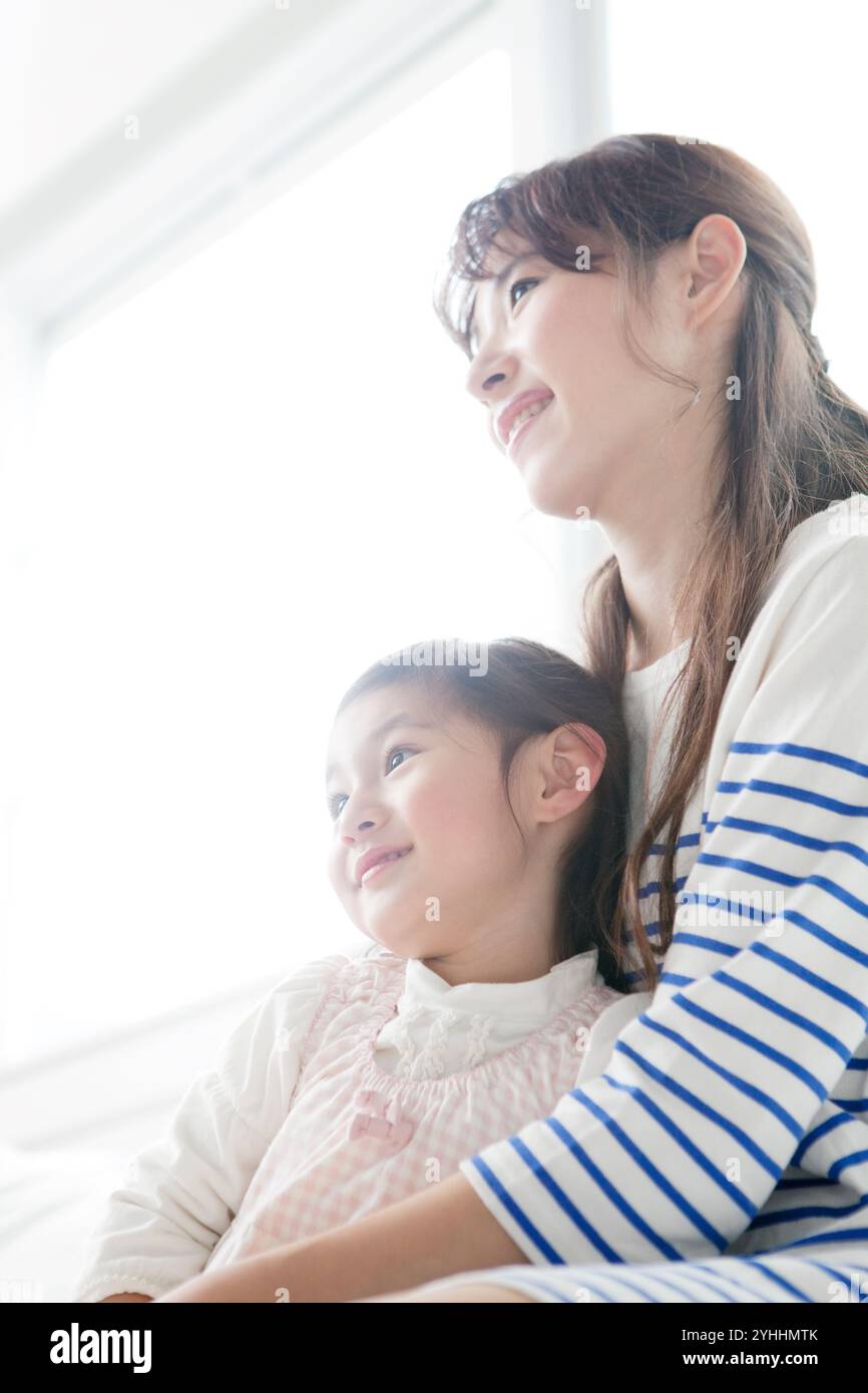Smiling mother and daughter Stock Photo - Alamy