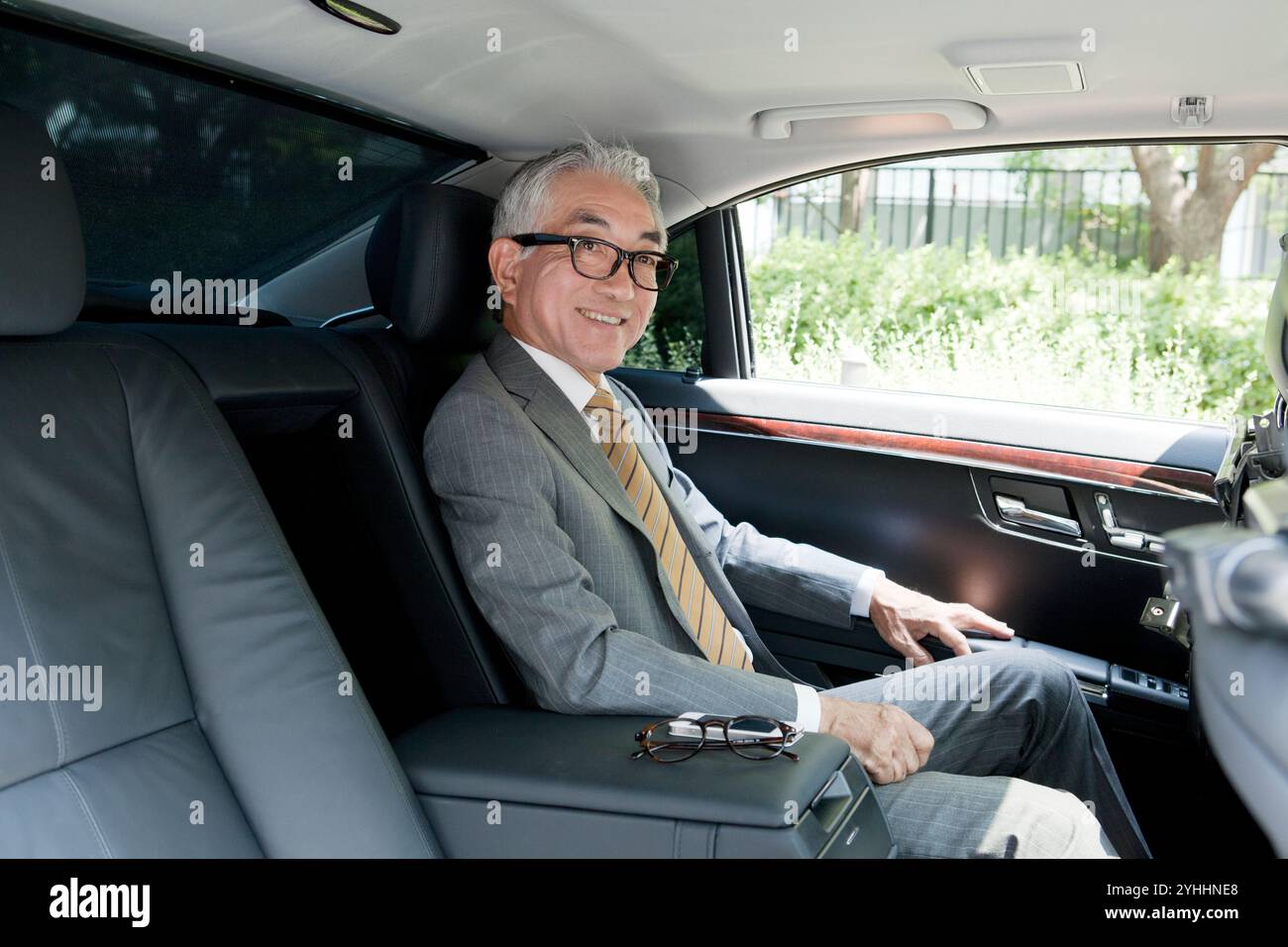 Middle-aged businessman inside a car Stock Photo - Alamy