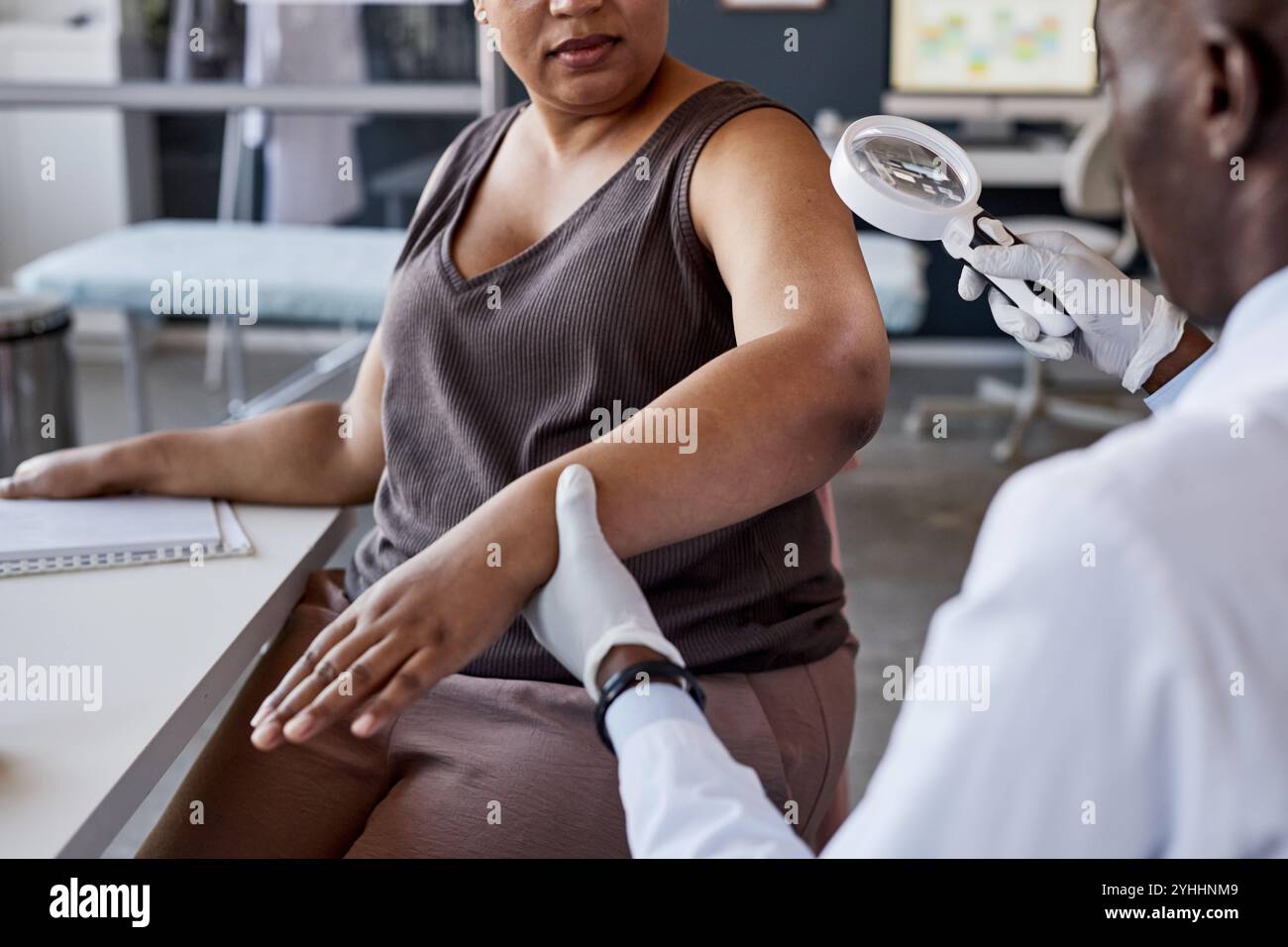 Cropped shot of unrecognizable African American woman in doctors office ...