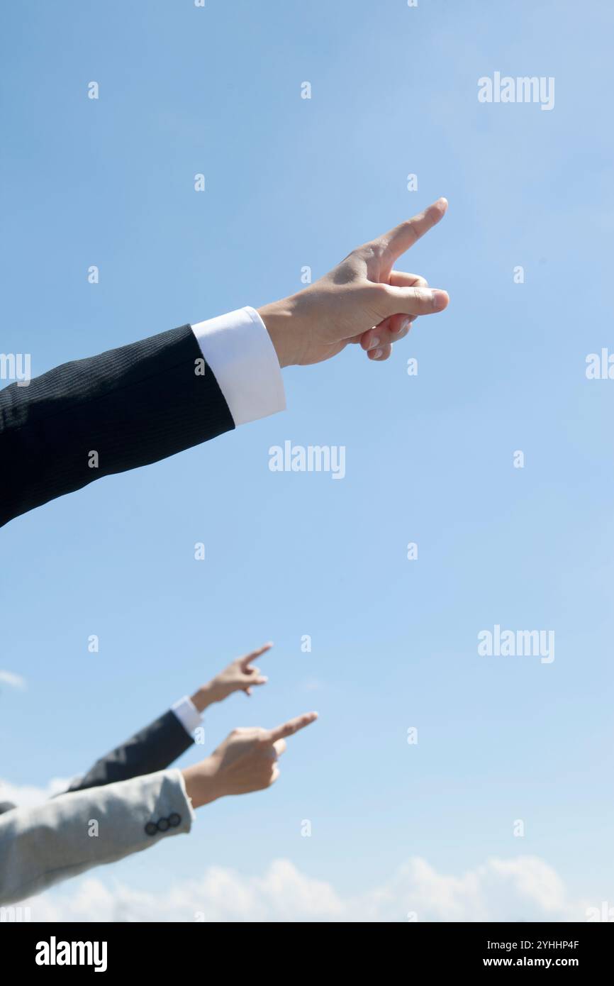 Finger-pointing businessman's arm Stock Photo - Alamy