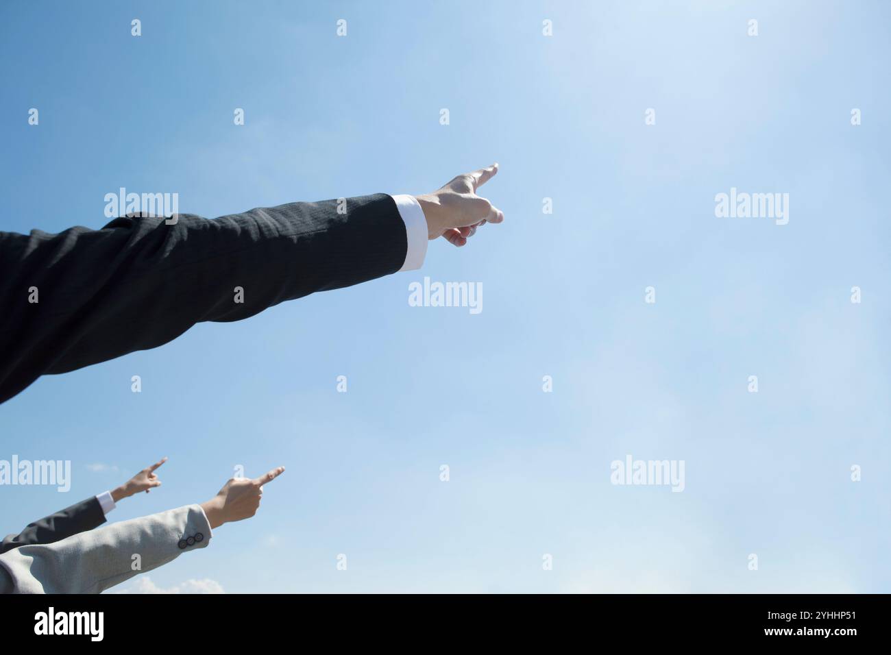 Finger-pointing businessman's arm Stock Photo - Alamy