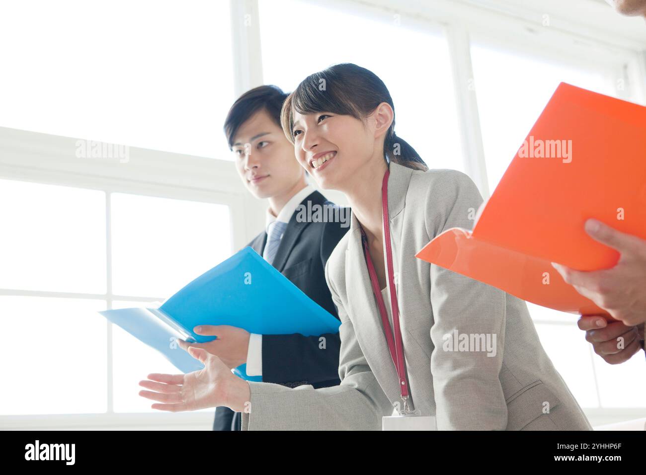 Three office workers during presentation Stock Photo - Alamy