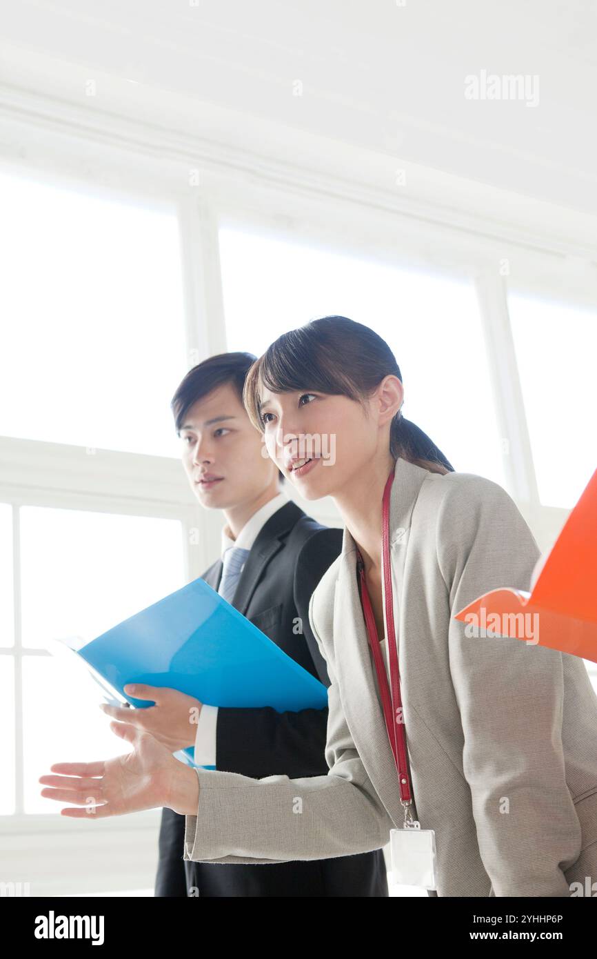 Two office workers during presentation Stock Photo - Alamy