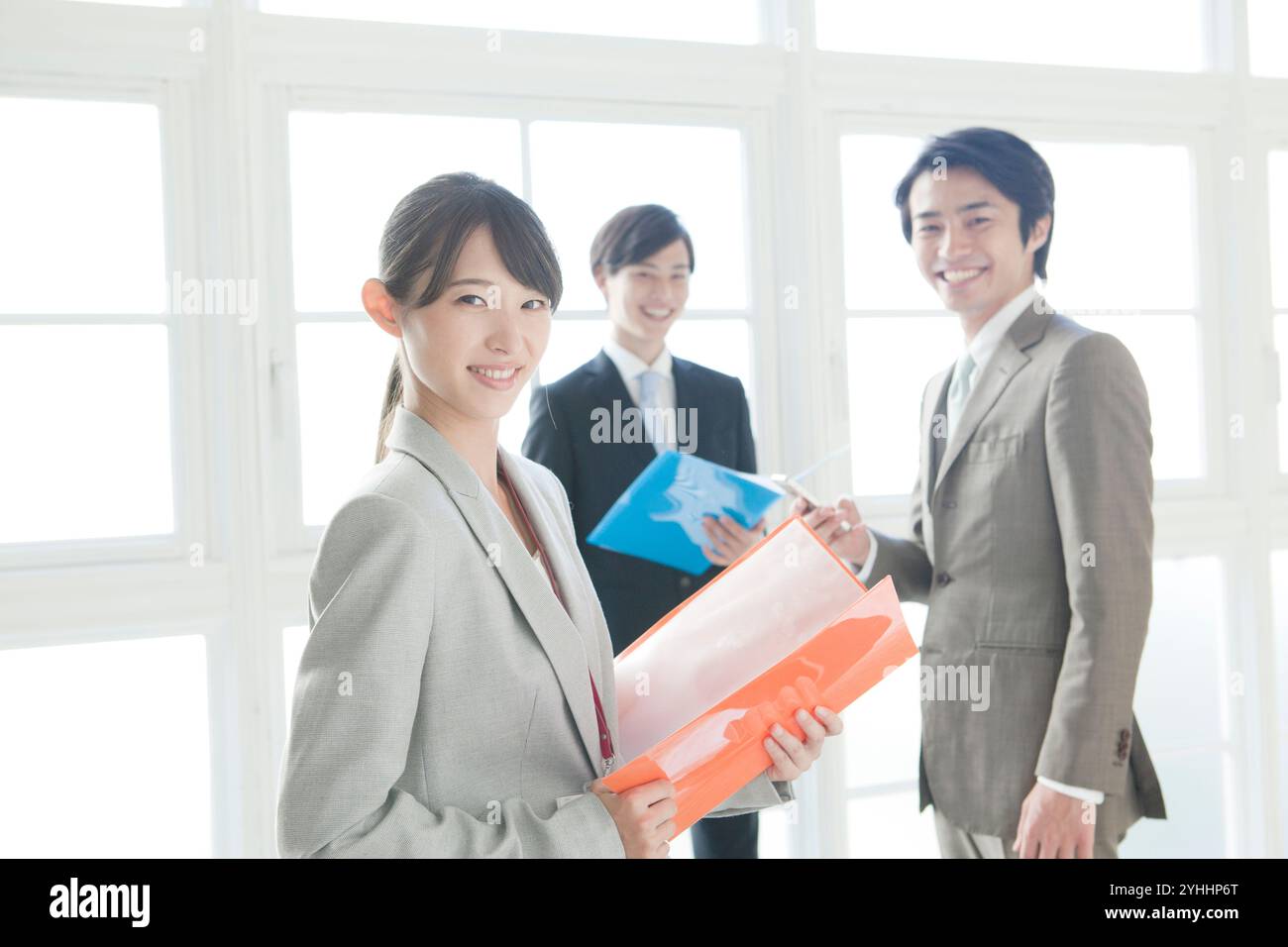 Portrait of three company employees Stock Photo - Alamy
