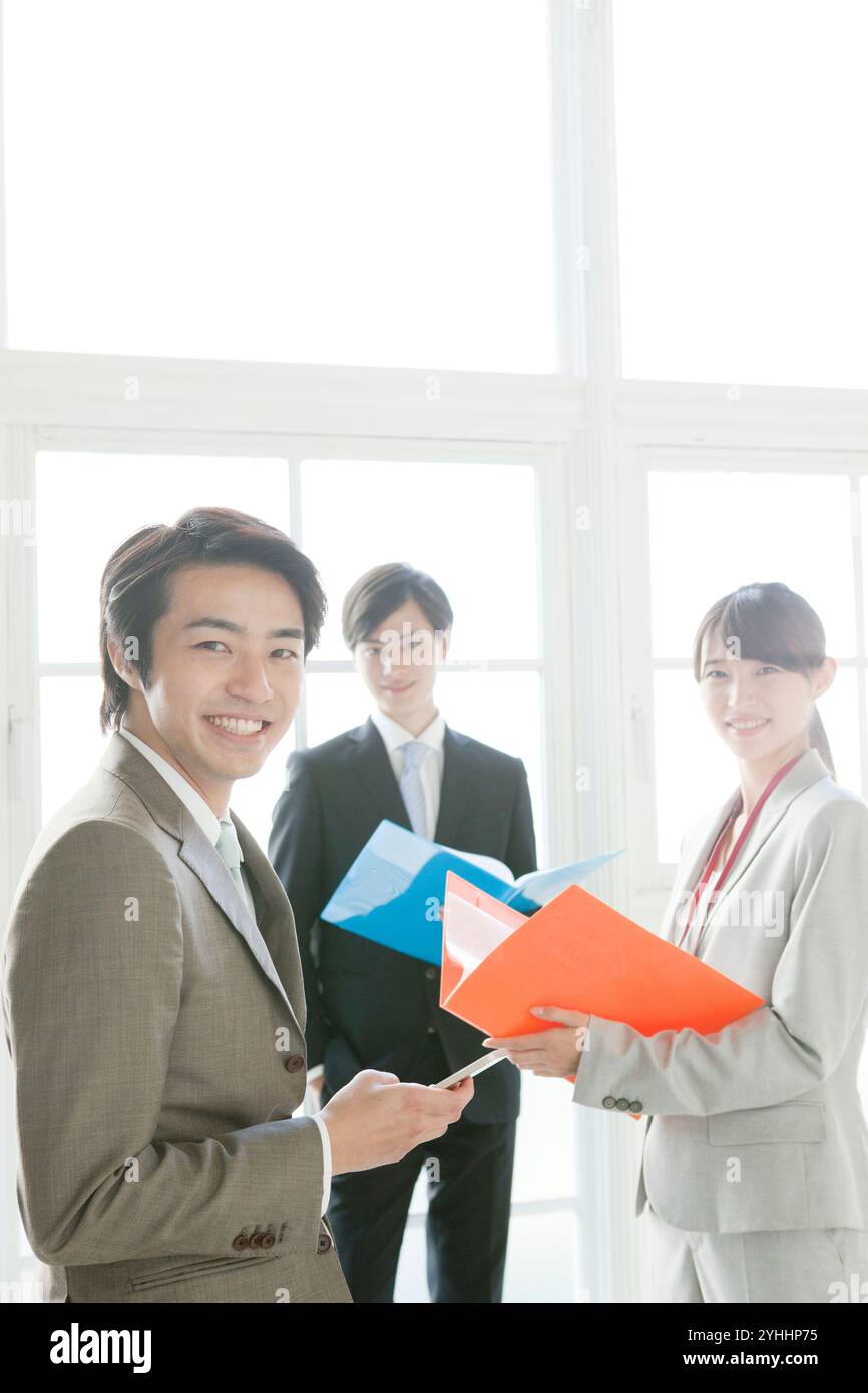 Portrait of three company employees Stock Photo - Alamy