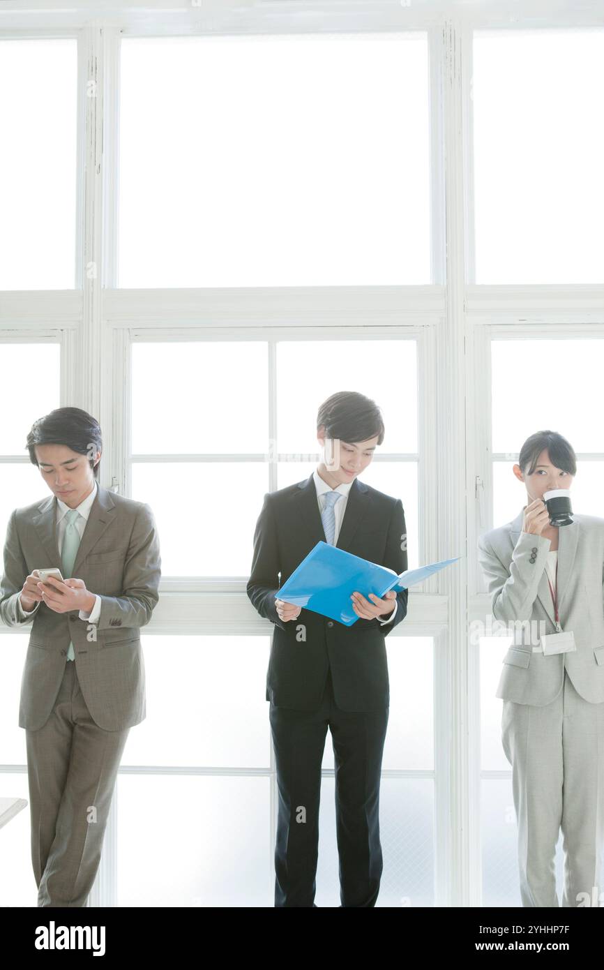 Three office workers during break Stock Photo - Alamy