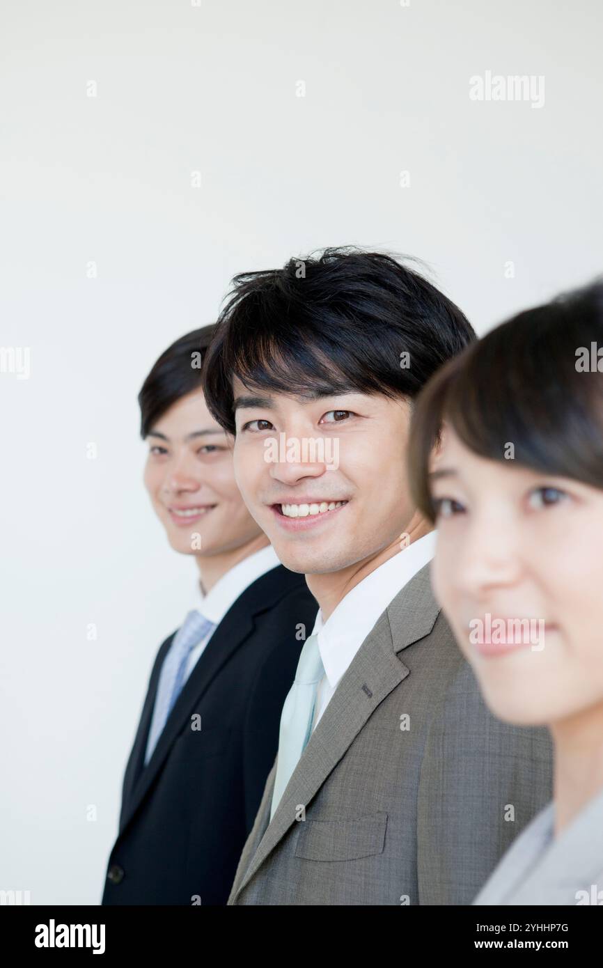 Three company employees photographed at an angle Stock Photo - Alamy