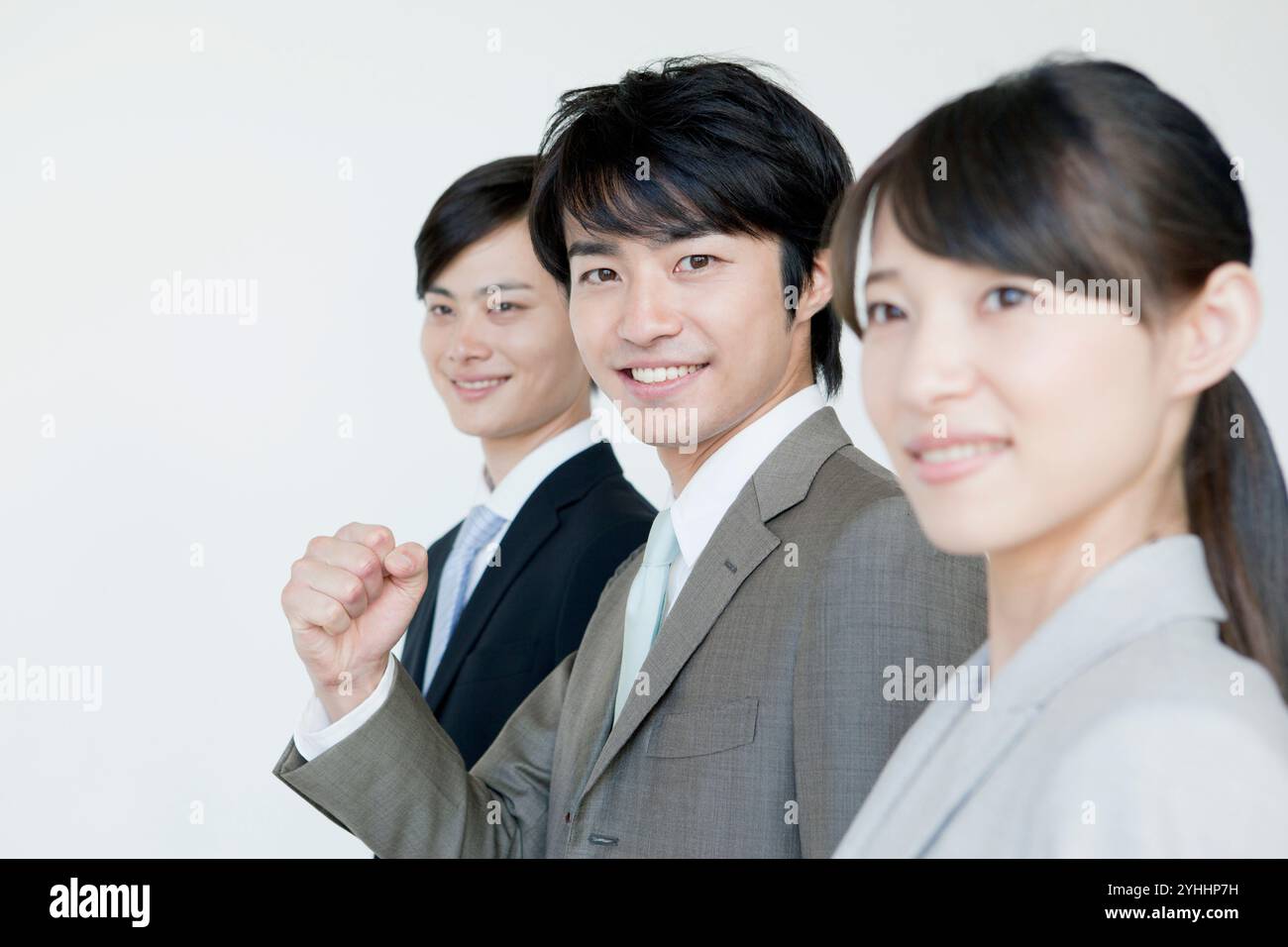 Three company employees photographed at an angle Stock Photo - Alamy