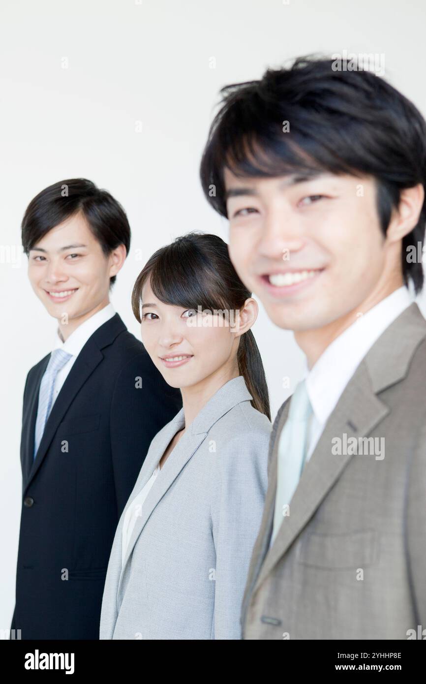 Three company employees photographed at an angle Stock Photo - Alamy