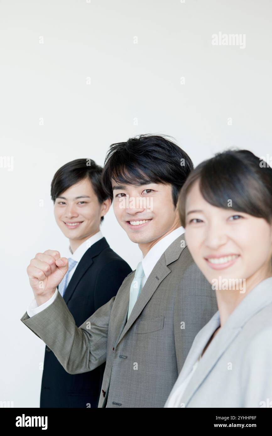 Three company employees photographed at an angle Stock Photo - Alamy