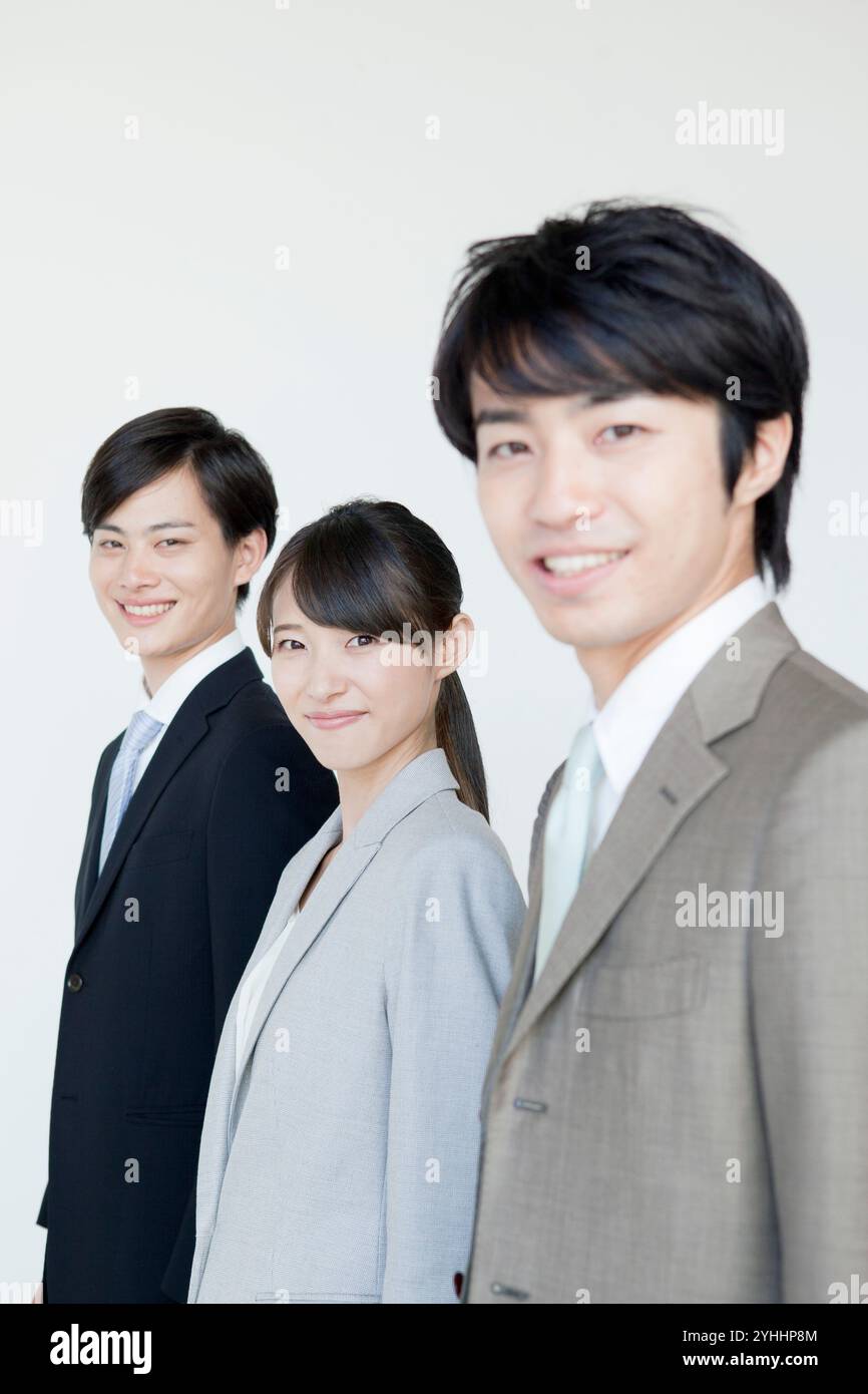 Three company employees photographed at an angle Stock Photo - Alamy