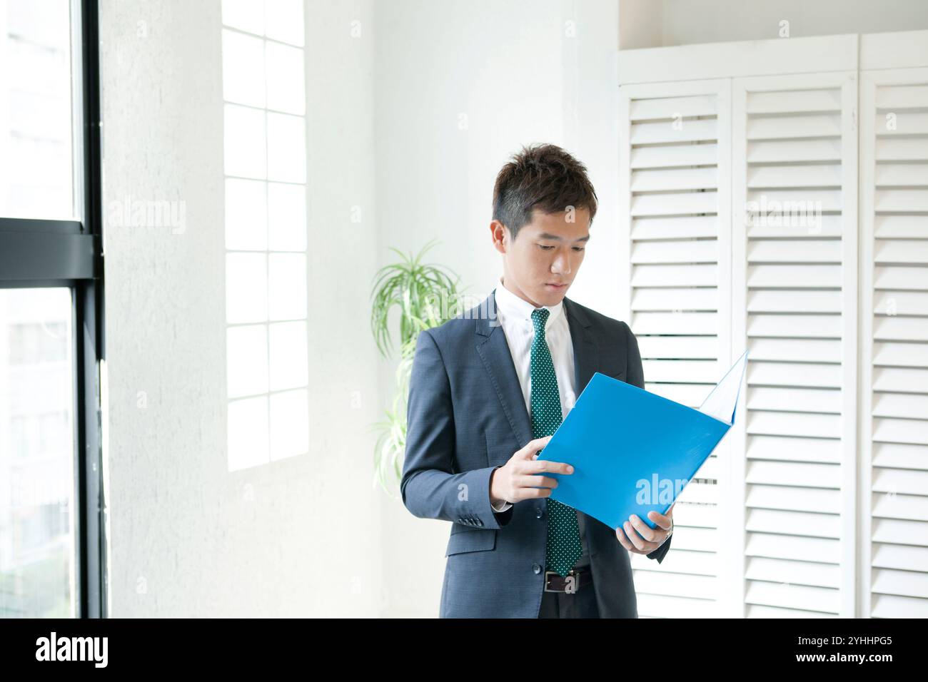 Young businessman looking documents hi-res stock photography and images ...