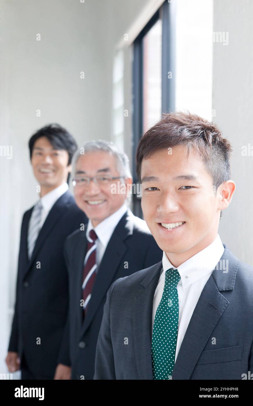 Three smiling businessmen Stock Photo - Alamy