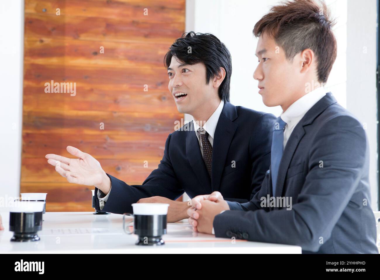 Two businessmen at table hi-res stock photography and images - Alamy