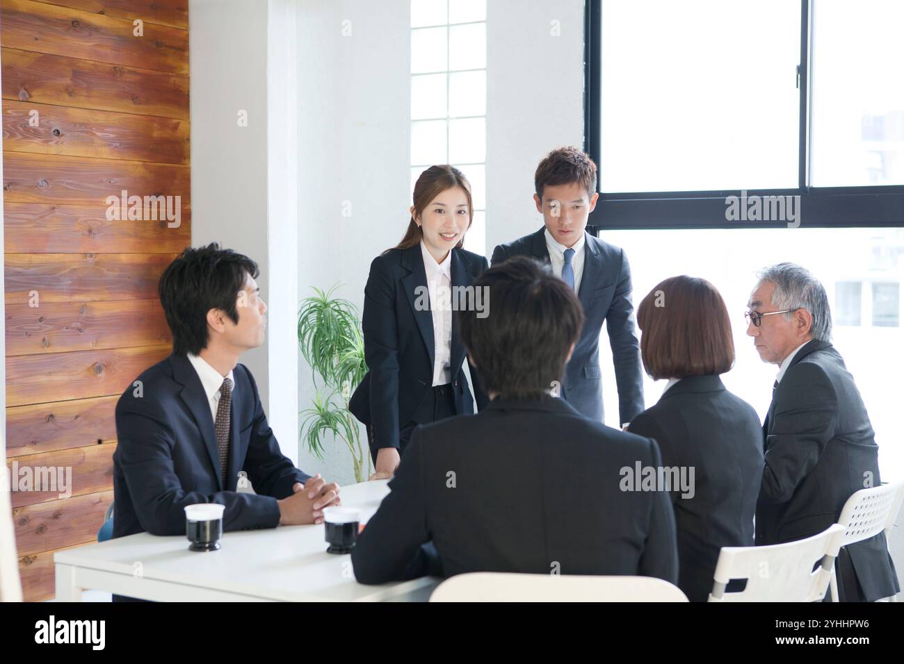Employees during meeting Stock Photo - Alamy