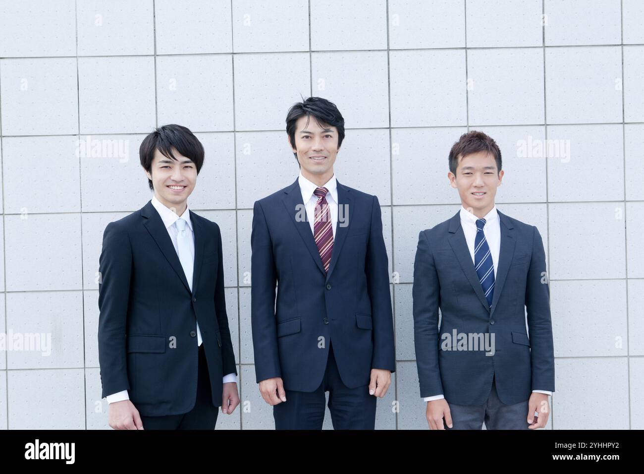 Three smiling businessmen Stock Photo - Alamy