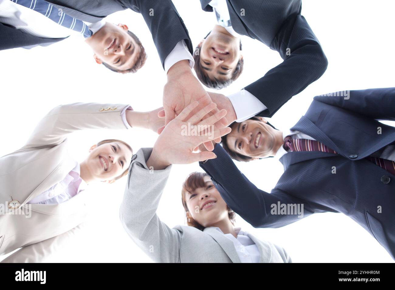 Business team of five people holding hands Stock Photo - Alamy