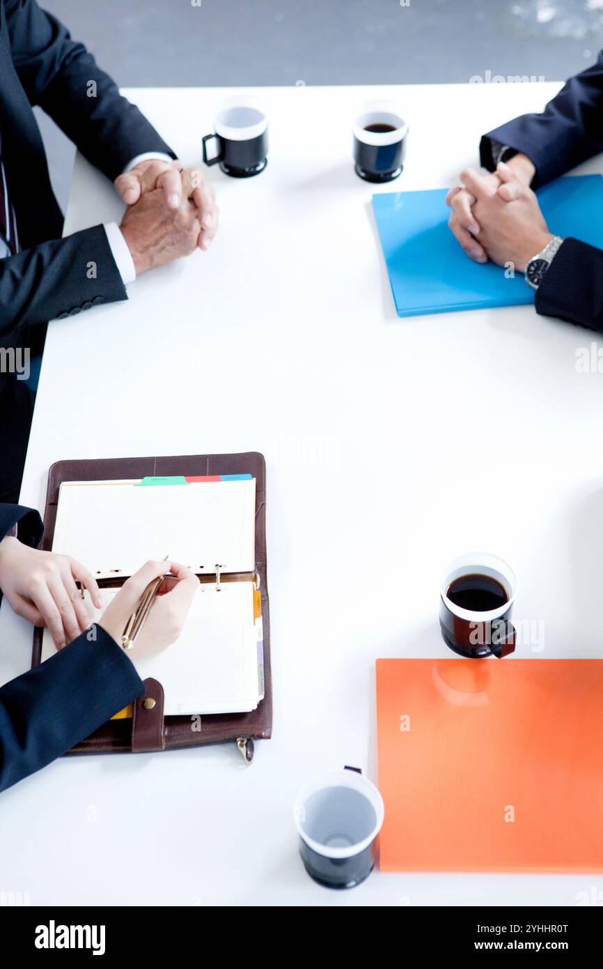 Meeting scene high angle Stock Photo - Alamy