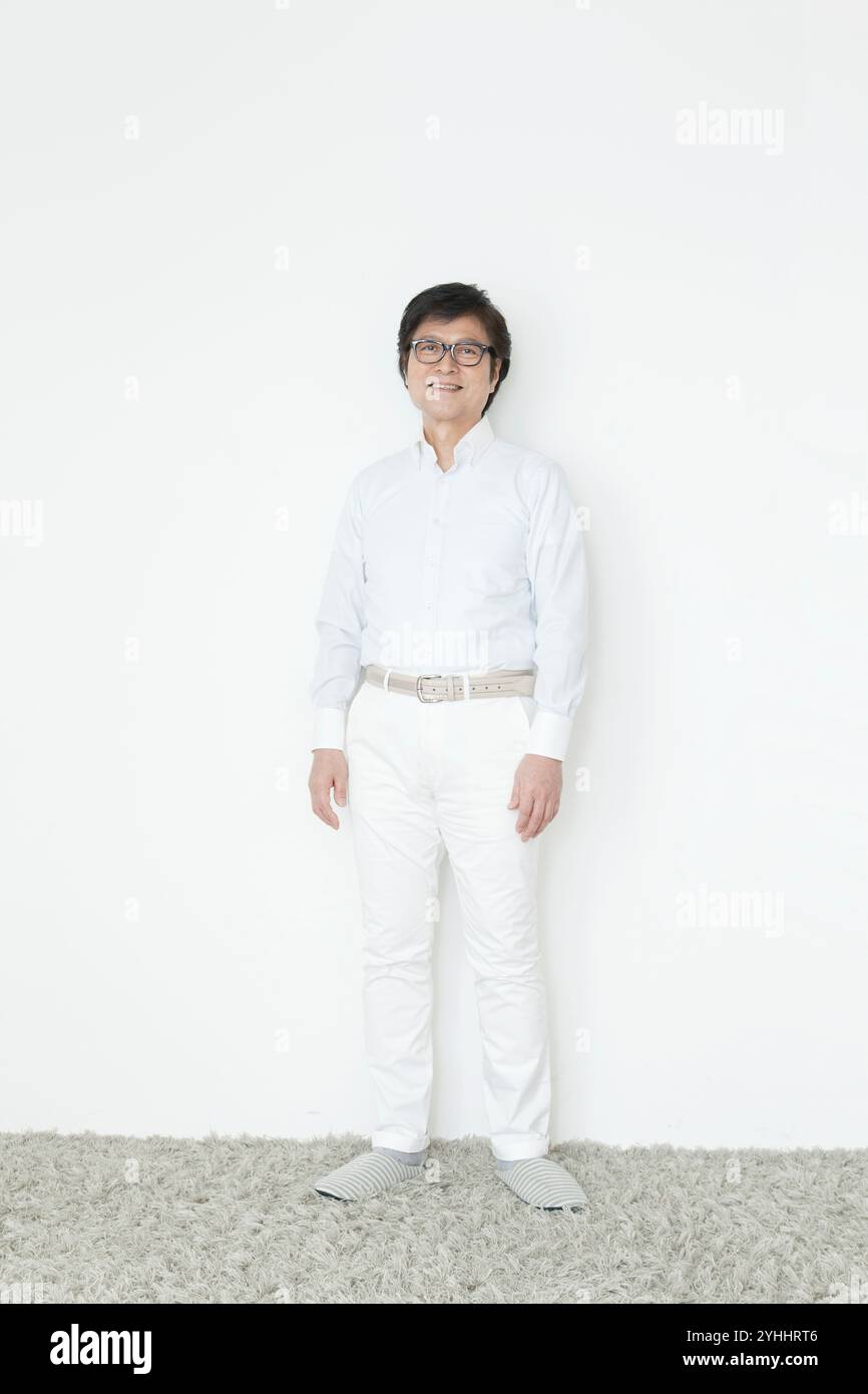 Smiling man in his 60s Stock Photo - Alamy