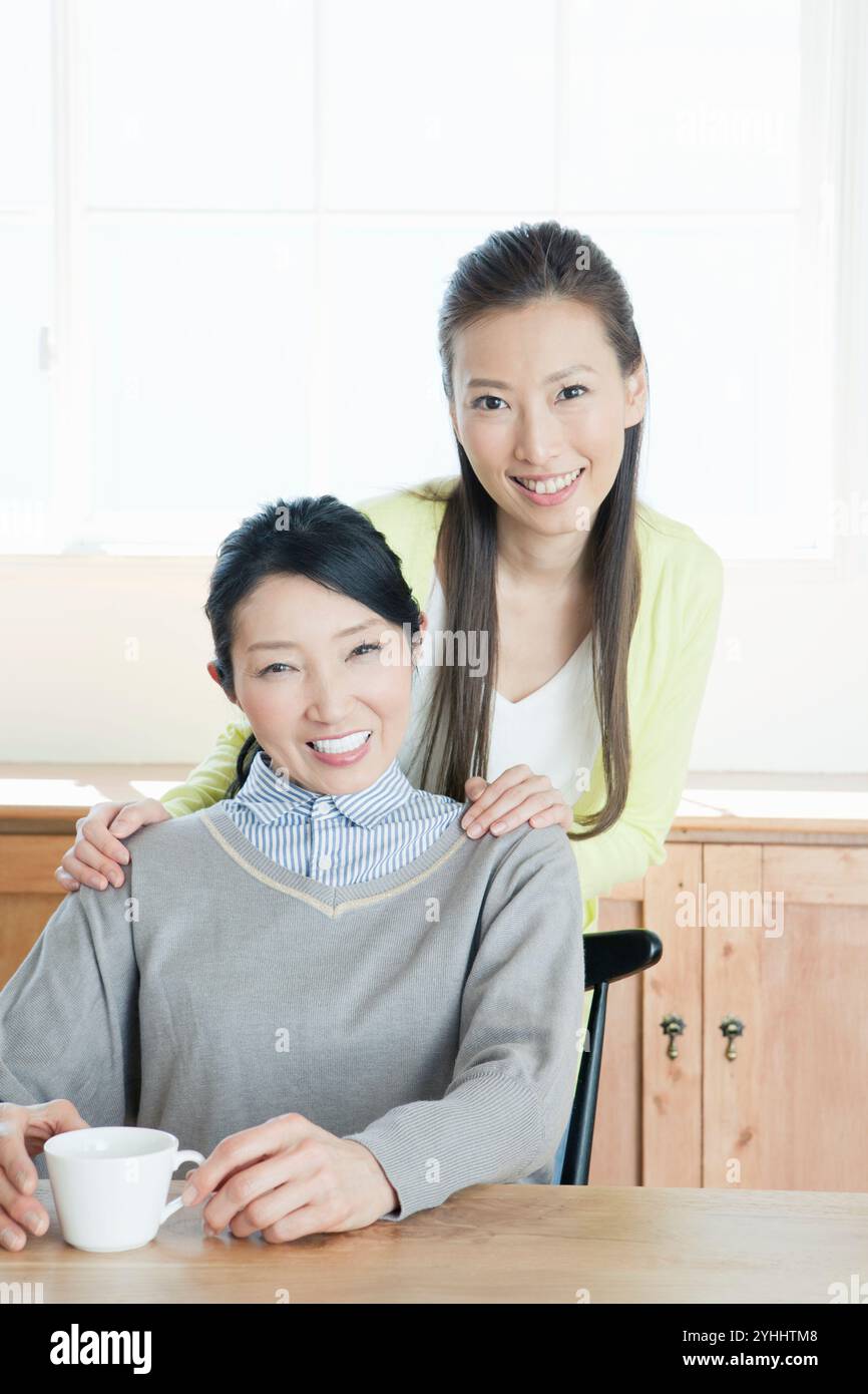 Parent and child enjoying tea Stock Photo - Alamy