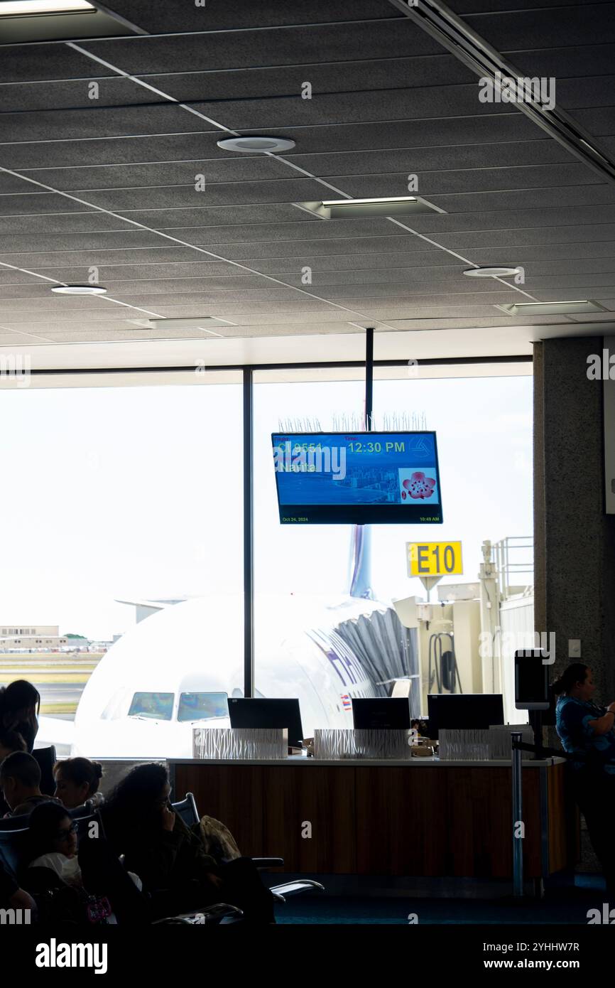 Flight departure at an airport terminal with a view of a jet and ...
