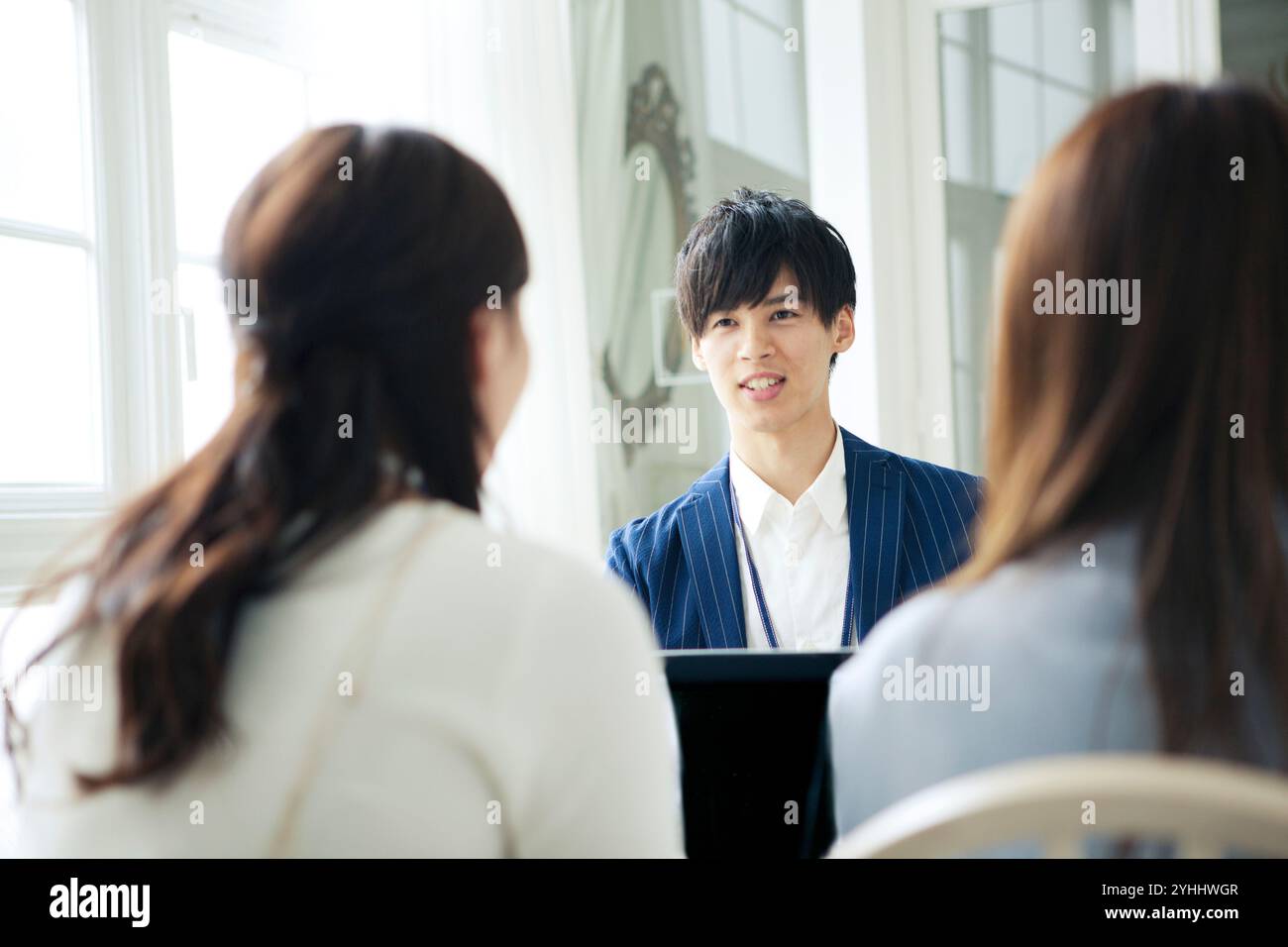 Meeting scene with three people Stock Photo - Alamy