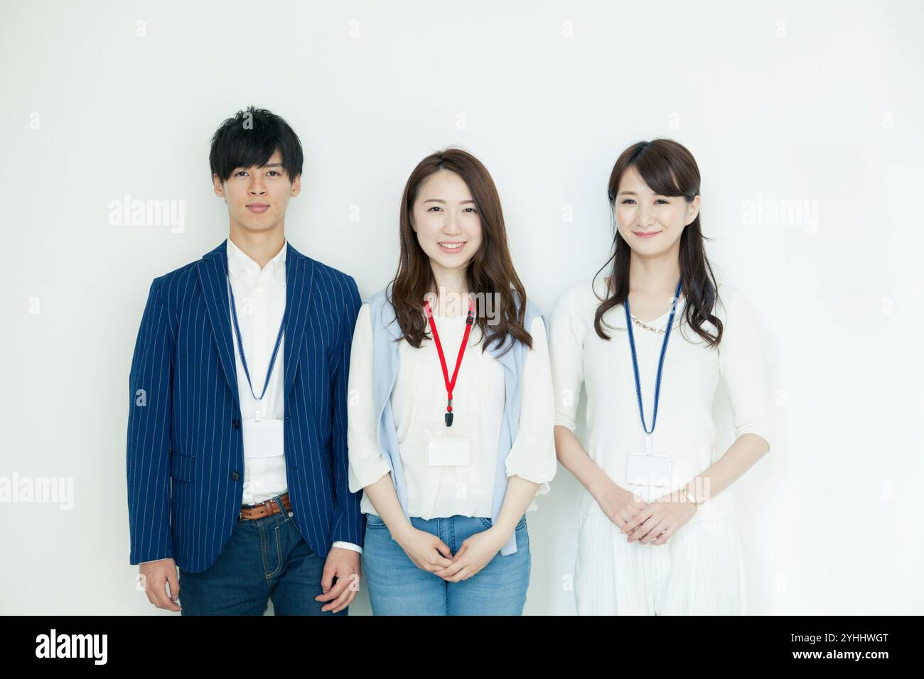 Portrait of three office workers in their 20s Stock Photo - Alamy